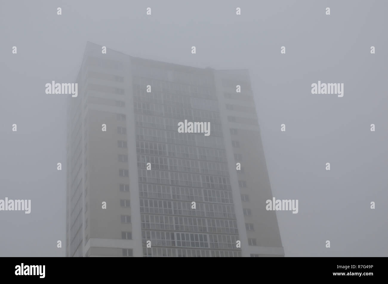 Residential multi-storey building with windows and balconies in a thick ...