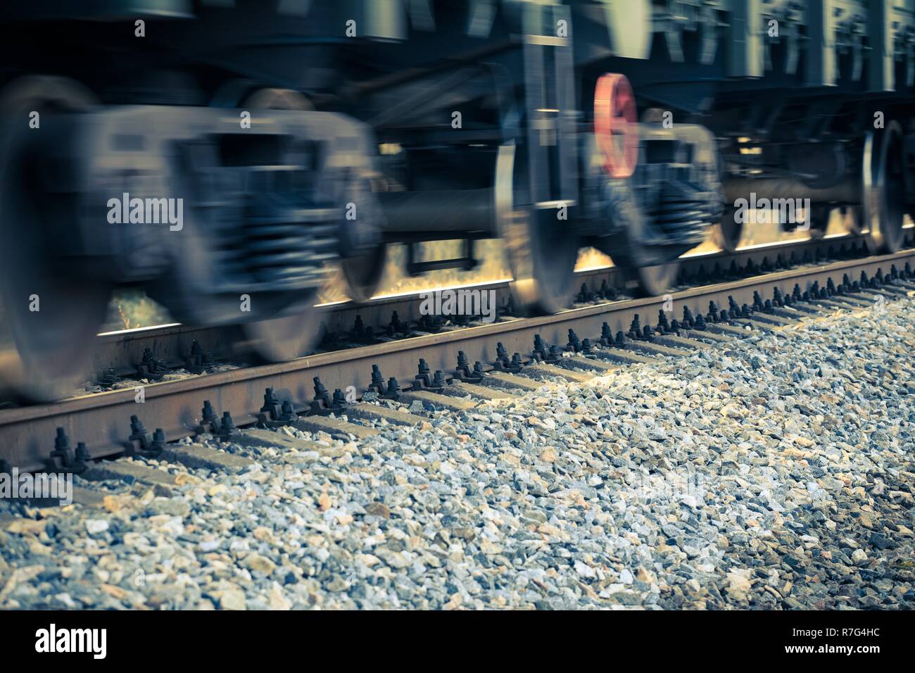 blurred motion of spinning train wheels close up Stock Photo - Alamy