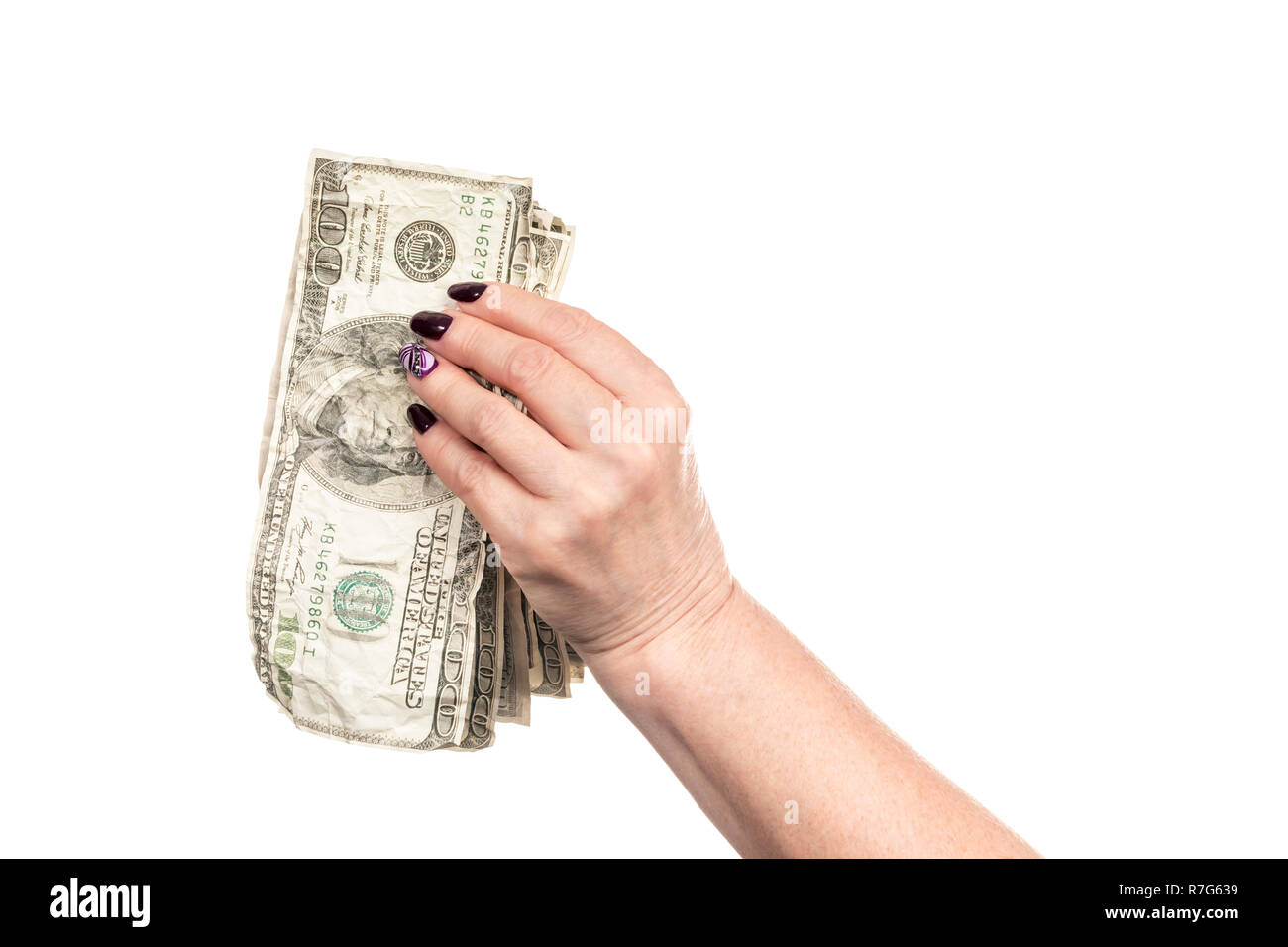 crumpled money in female hand Stock Photo - Alamy