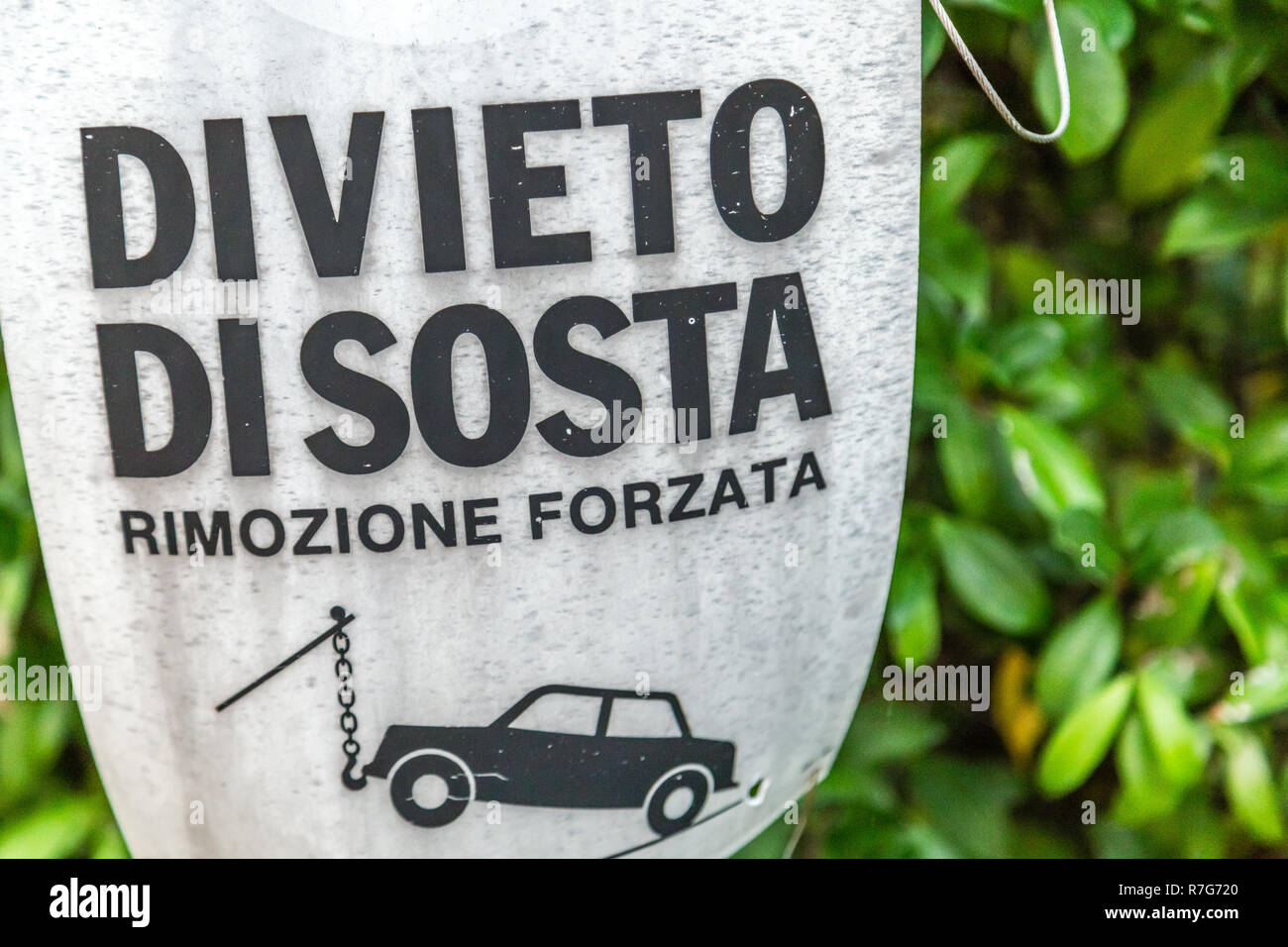 Italian signboard with words meaning No Parking, illegally parked ... Italian signboard with words meaning No Parking, illegally parked ...