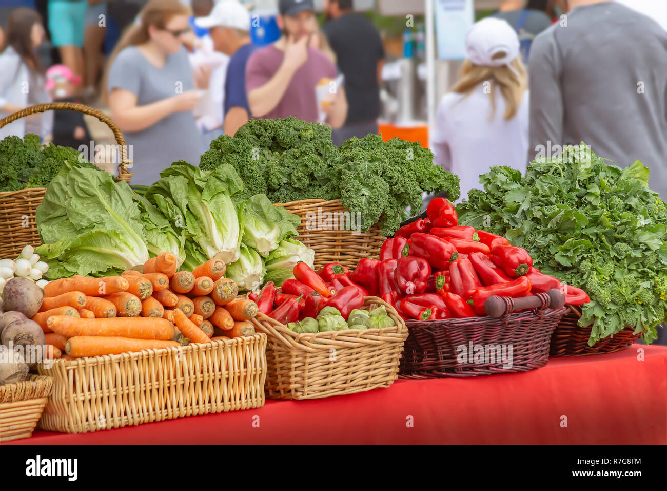 People enjoy the morning outdoors at the local green farmers market ...