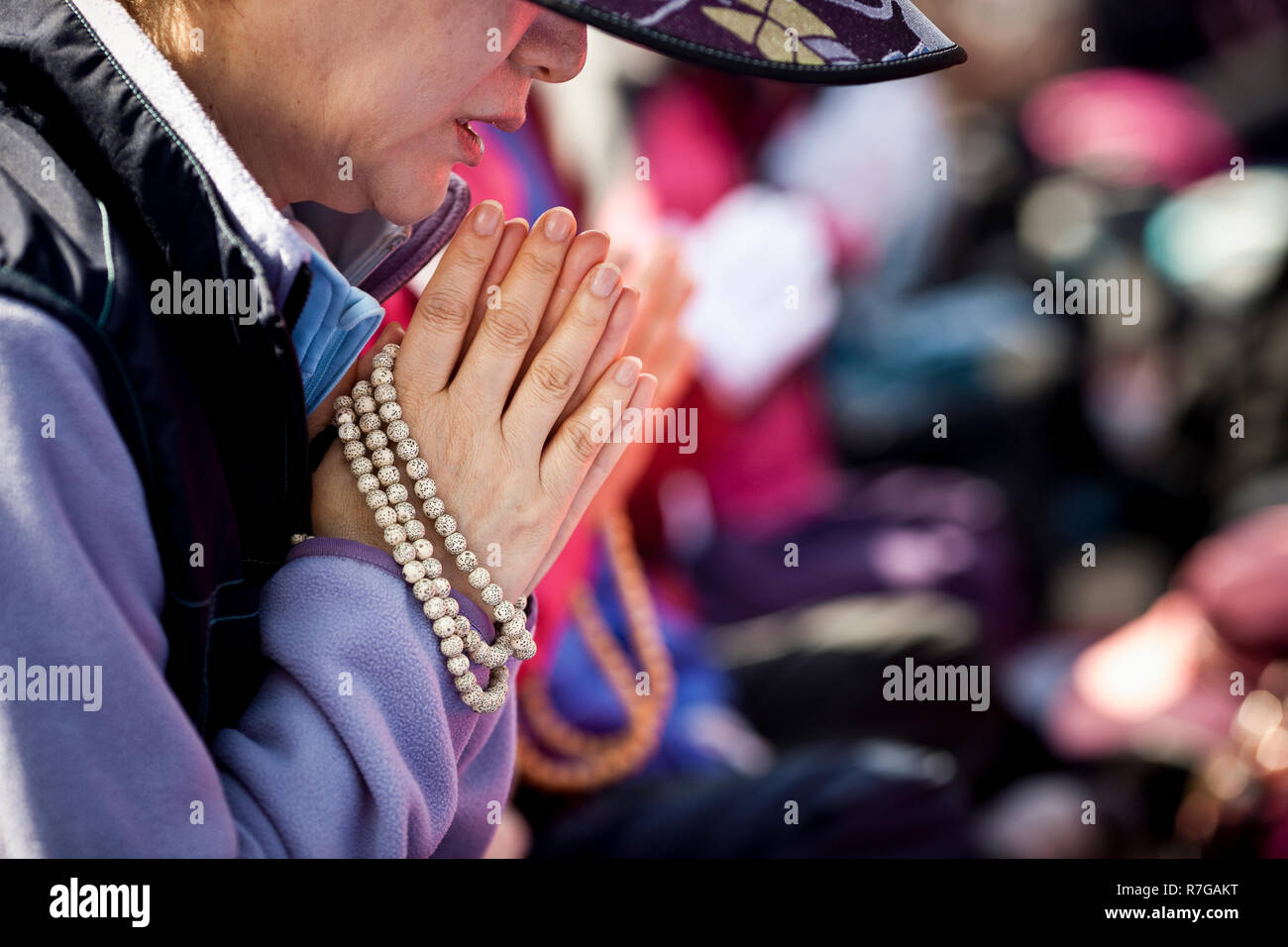 The Buddhist have their hands together as if in prayer at Temple, South ...
