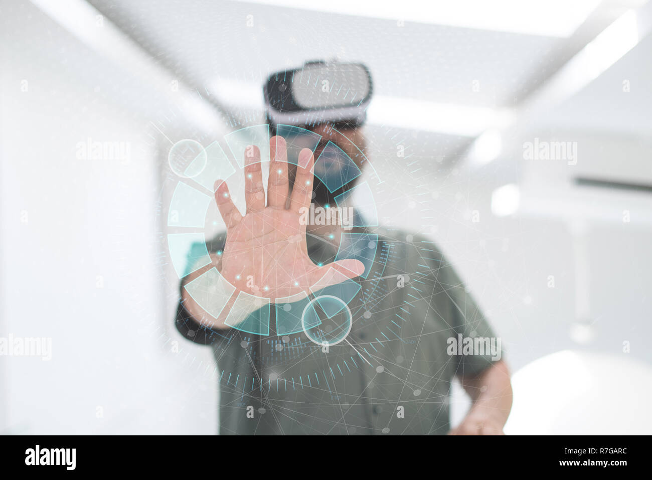 man trying virtual reality vr glasses at modern home with futuristic ...