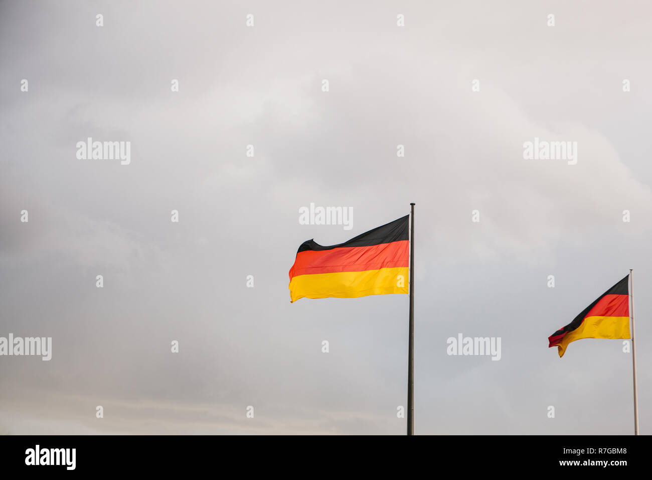 German national flags in the wind against the sky Stock Photo - Alamy