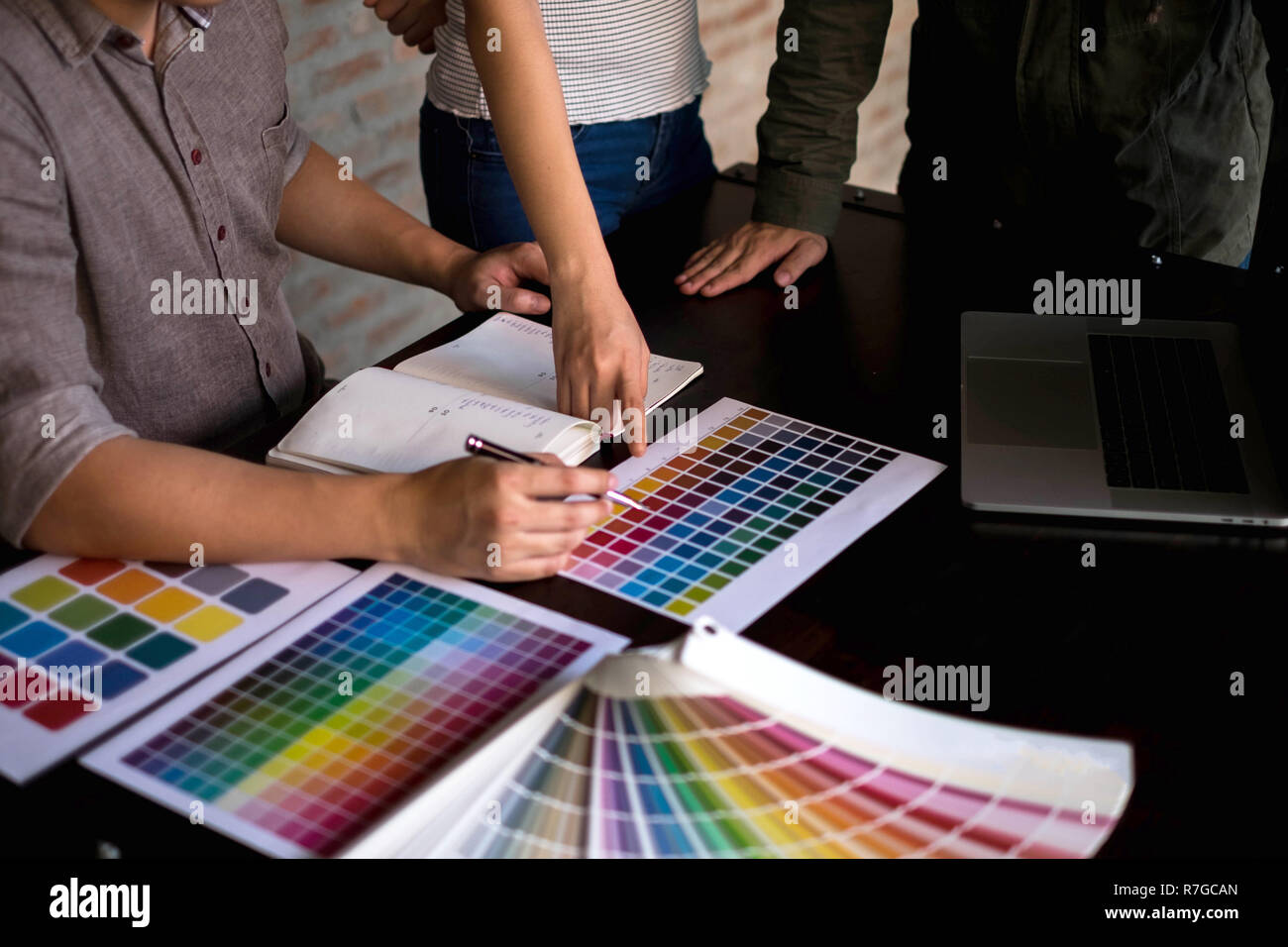 Graphic designers choose colors from the color bands samples for design ...