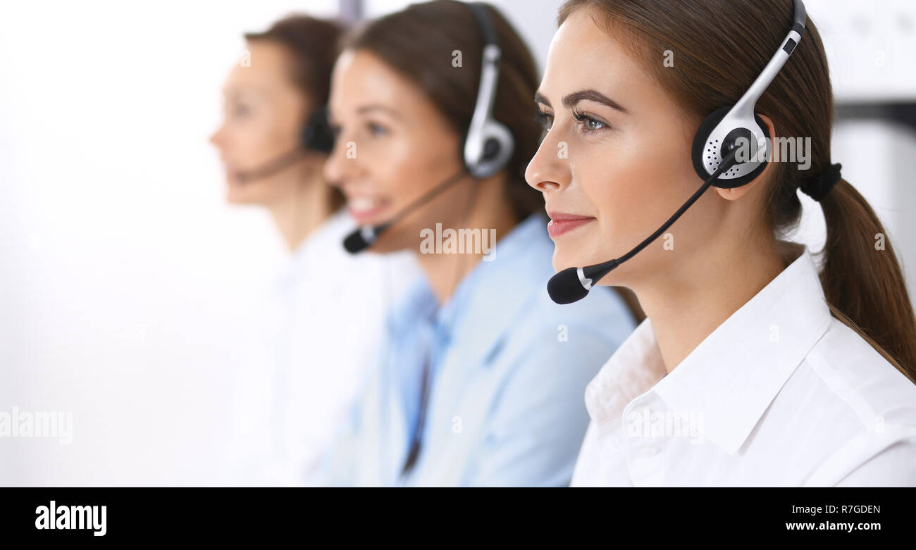 Call center. Group of operators at work. Focus at beautiful business ...