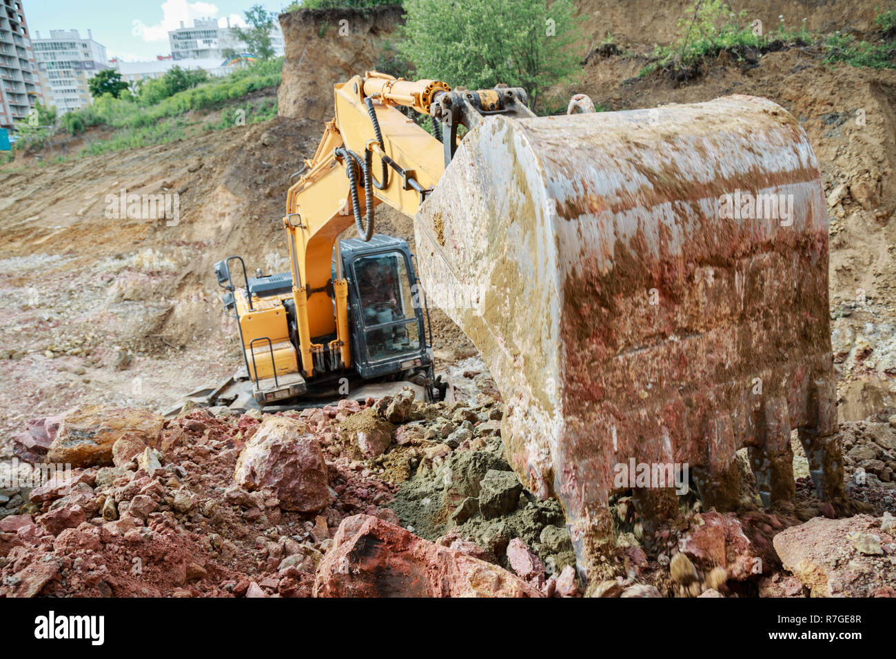 Excavator work at a construction site. Bucket closeup Stock Photo - Alamy
