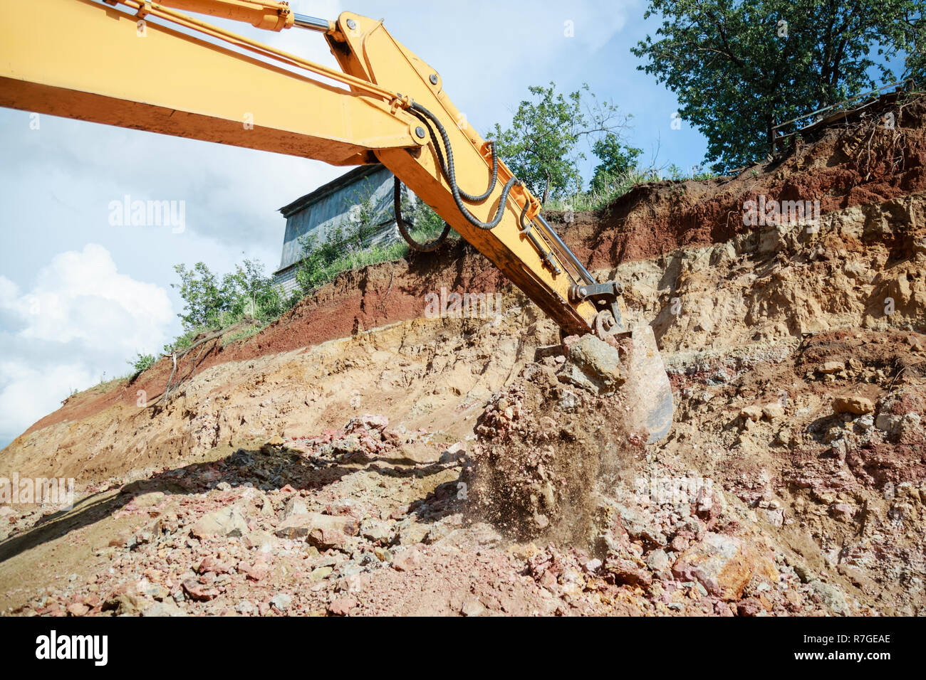 Excavator work on the construction site. Bucket closeup Stock Photo - Alamy