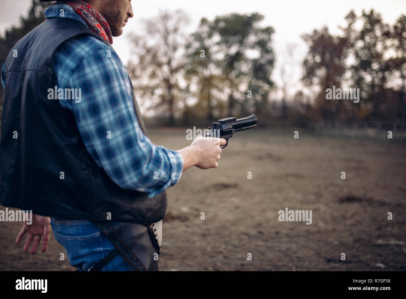 Cowboy with revolver, front view, gunfight on texas ranch, western ...