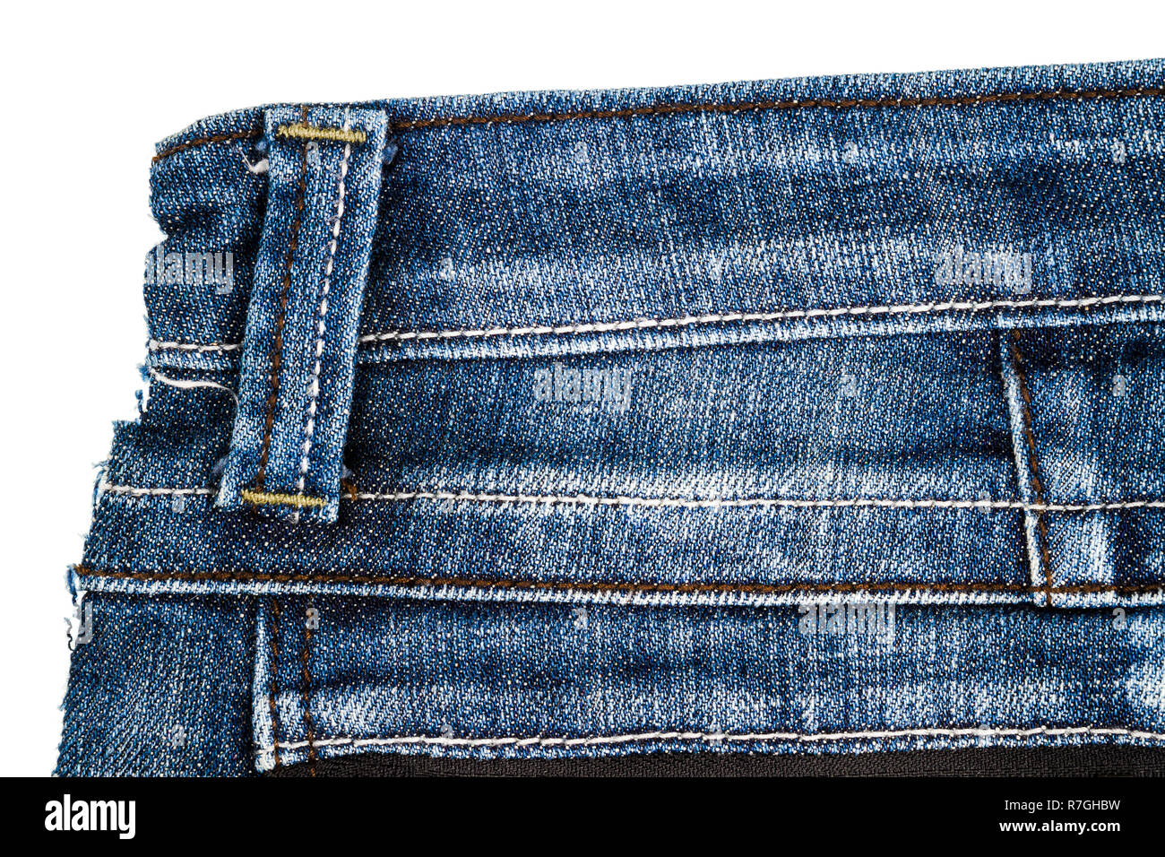 Piece of blue jeans fabric isolated on white background. Rough uneven ...