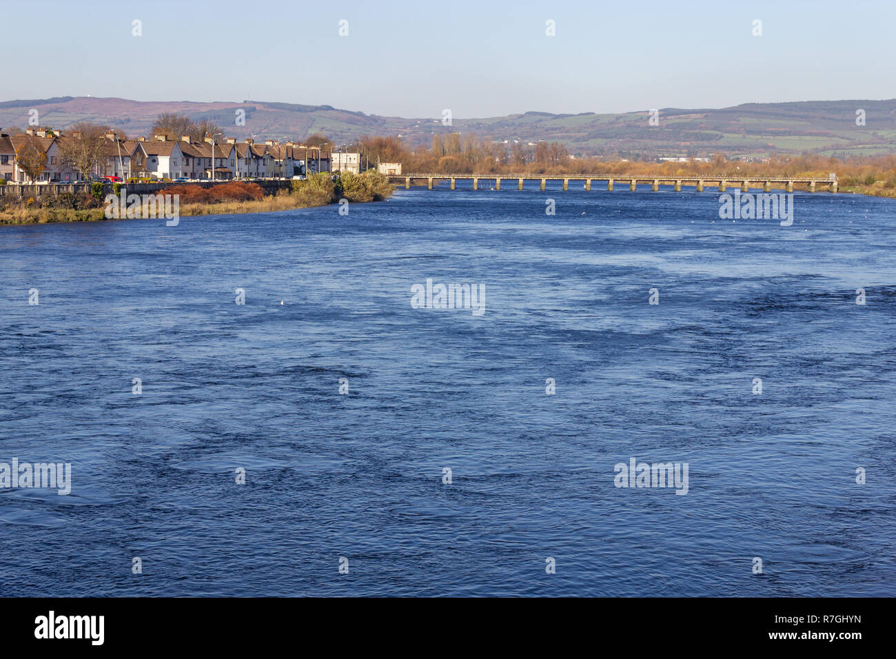 Stone bridge and houses at Shannon river, Limerick, Ireland Stock Photo ...