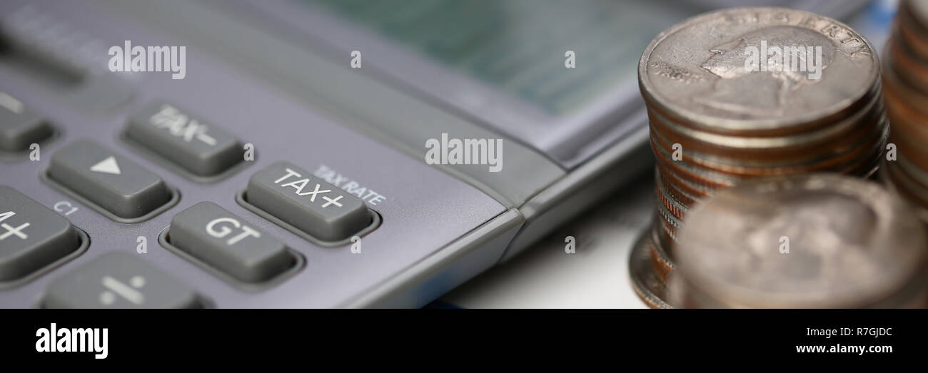 Silver calculator with gray keyboard is lying Stock Photo - Alamy