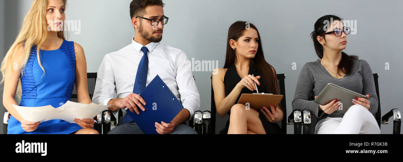 Group of people sit on casting chairs row Stock Photo - Alamy