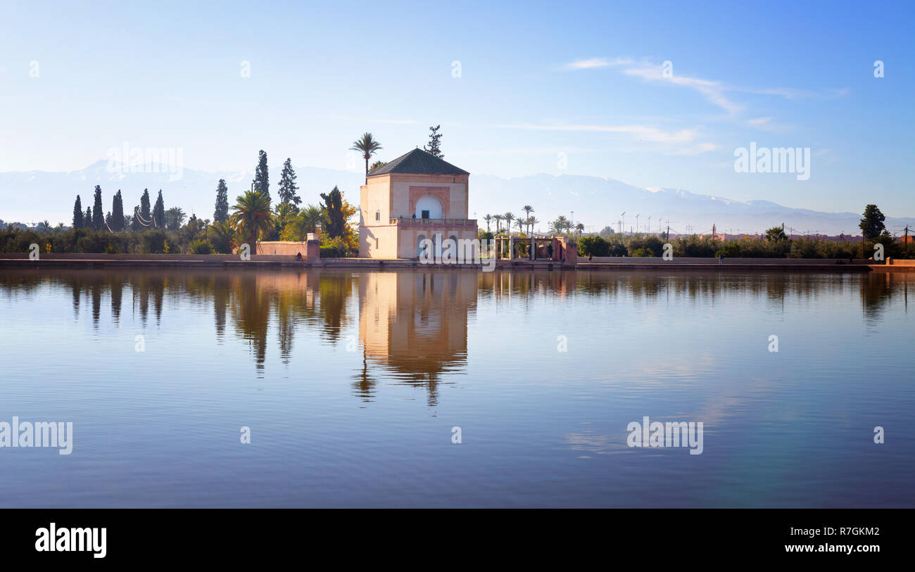 The Menara Gardens Marrakech Morocco, with pavilion and Atlas Mountains ...