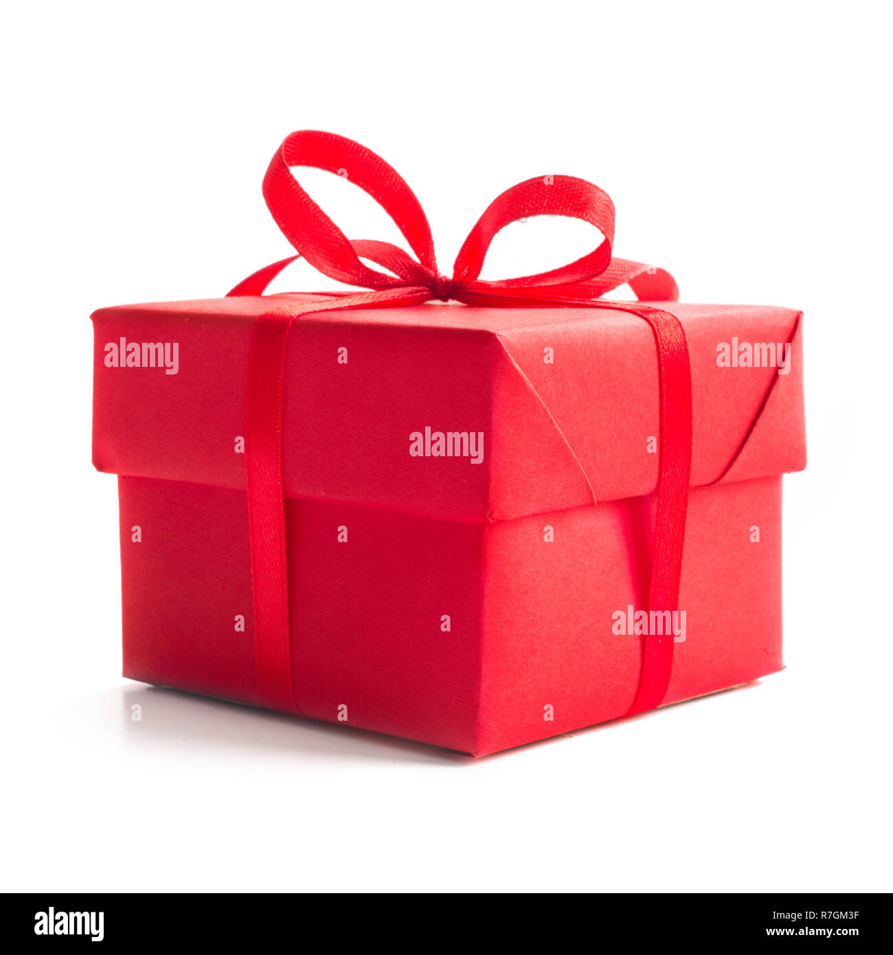 Red gift box with ribbon bow studio isolated on white background ...