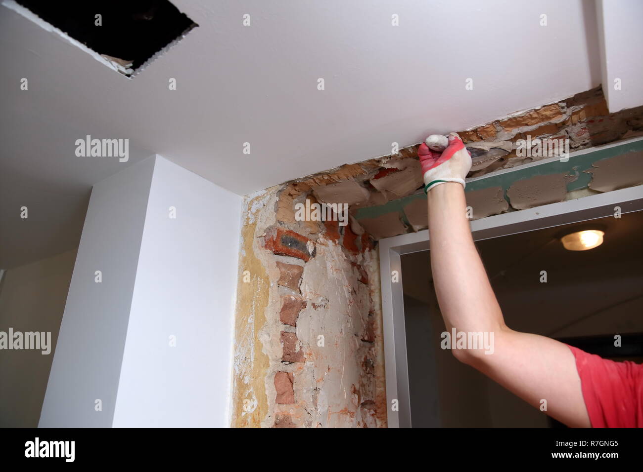 Filling walls and ceilings with plaster and gypsum plaster Stock Photo ...