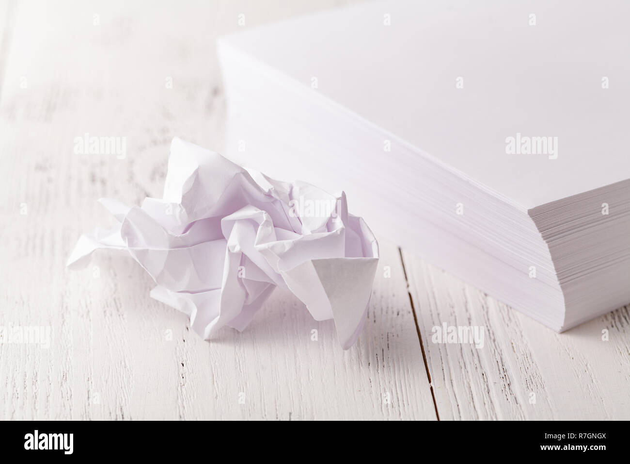 Stacked white paper on white background Stock Photo - Alamy