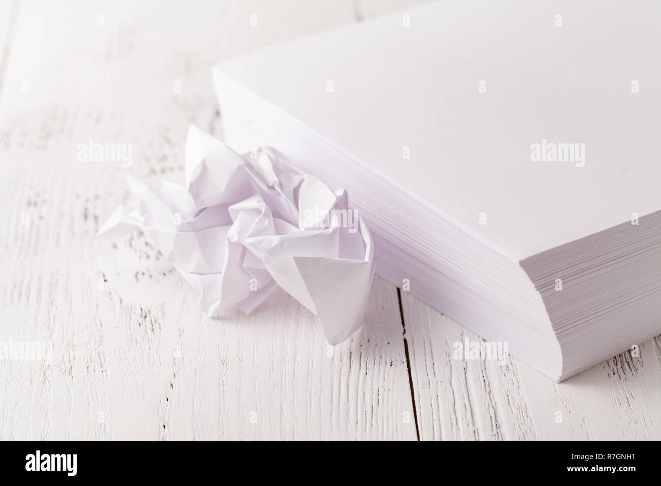 Stacked white paper on white background Stock Photo - Alamy