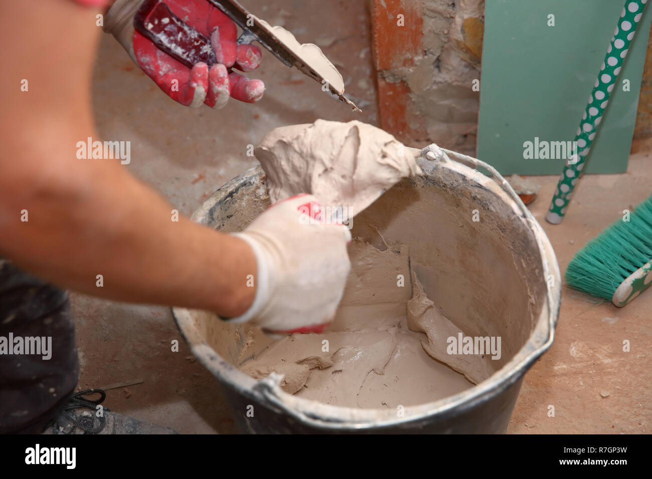Filling walls and ceilings with plaster and gypsum plaster Stock Photo ...