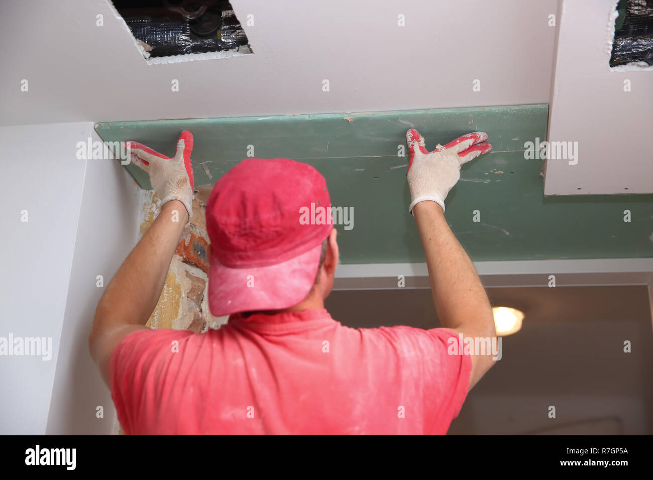 Filling walls and ceilings with plaster and gypsum plaster Stock Photo ...