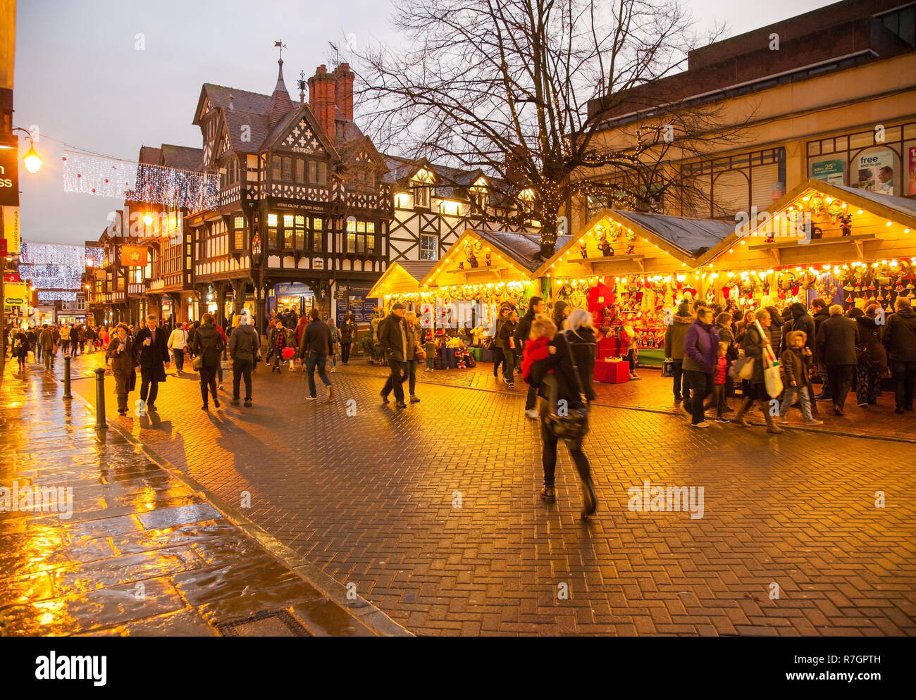 Christmas market at nighttime in front of the town hall in the historic ...
