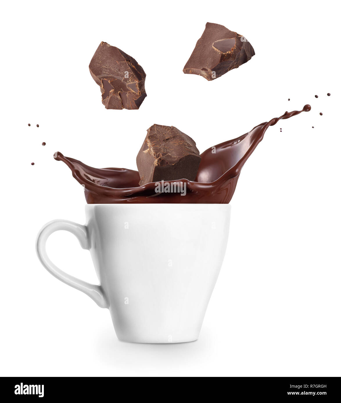 splashing hot chocolate with falling pieces in cup isolated on white ...