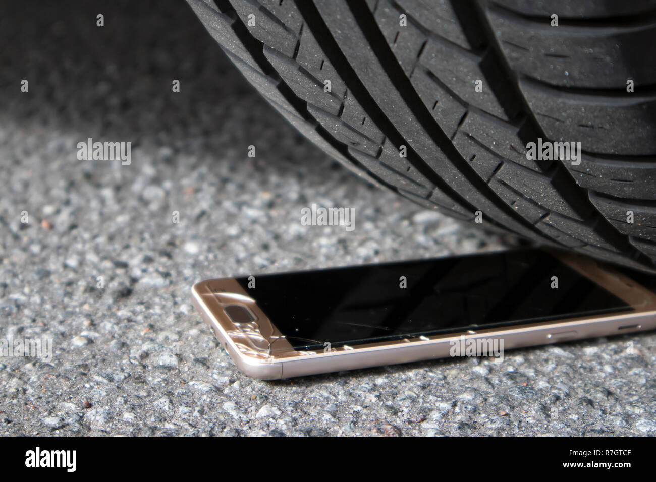 Phone under wheel hi-res stock photography and images - Alamy