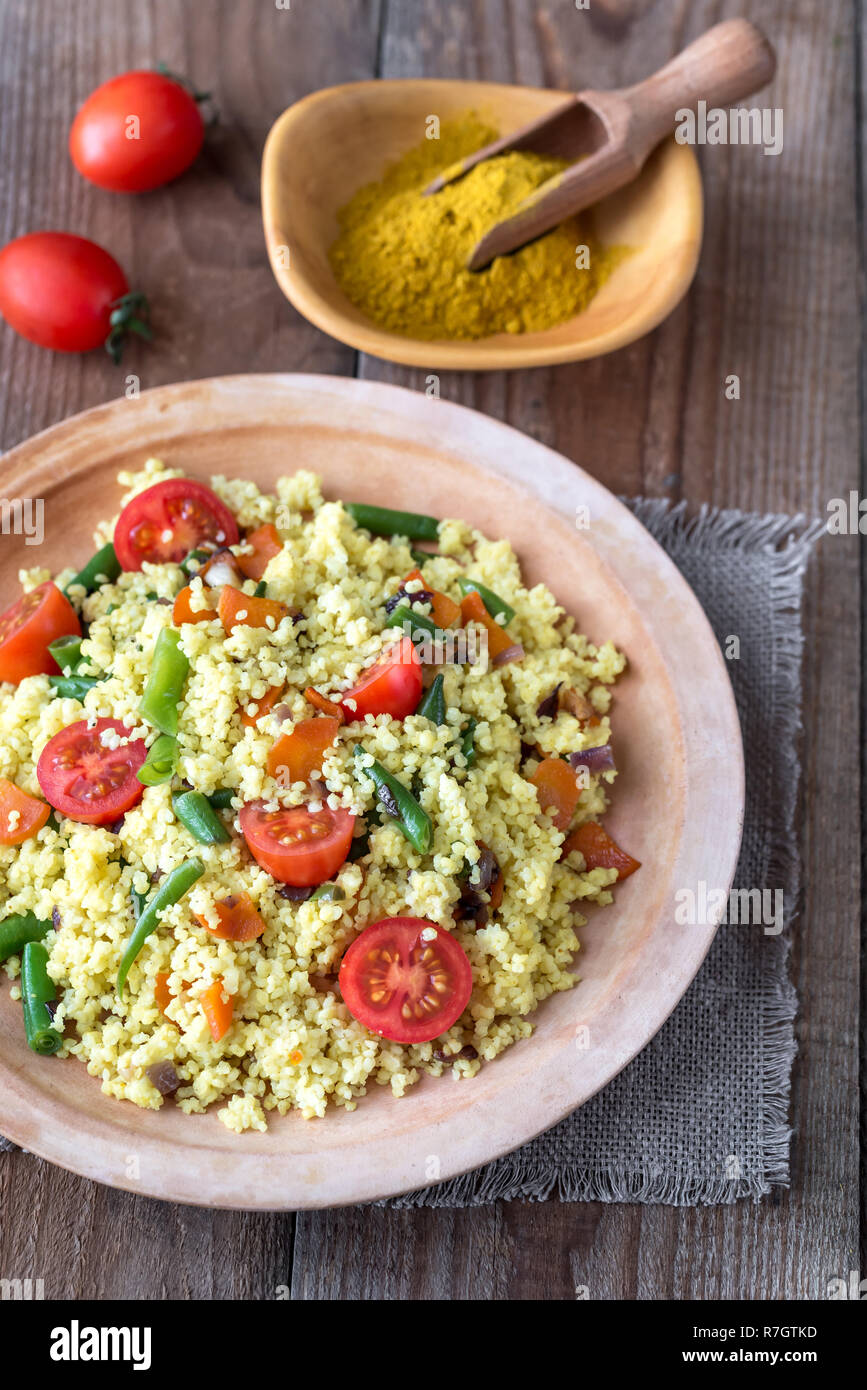 Millet stir-fry with vegetables Stock Photo - Alamy