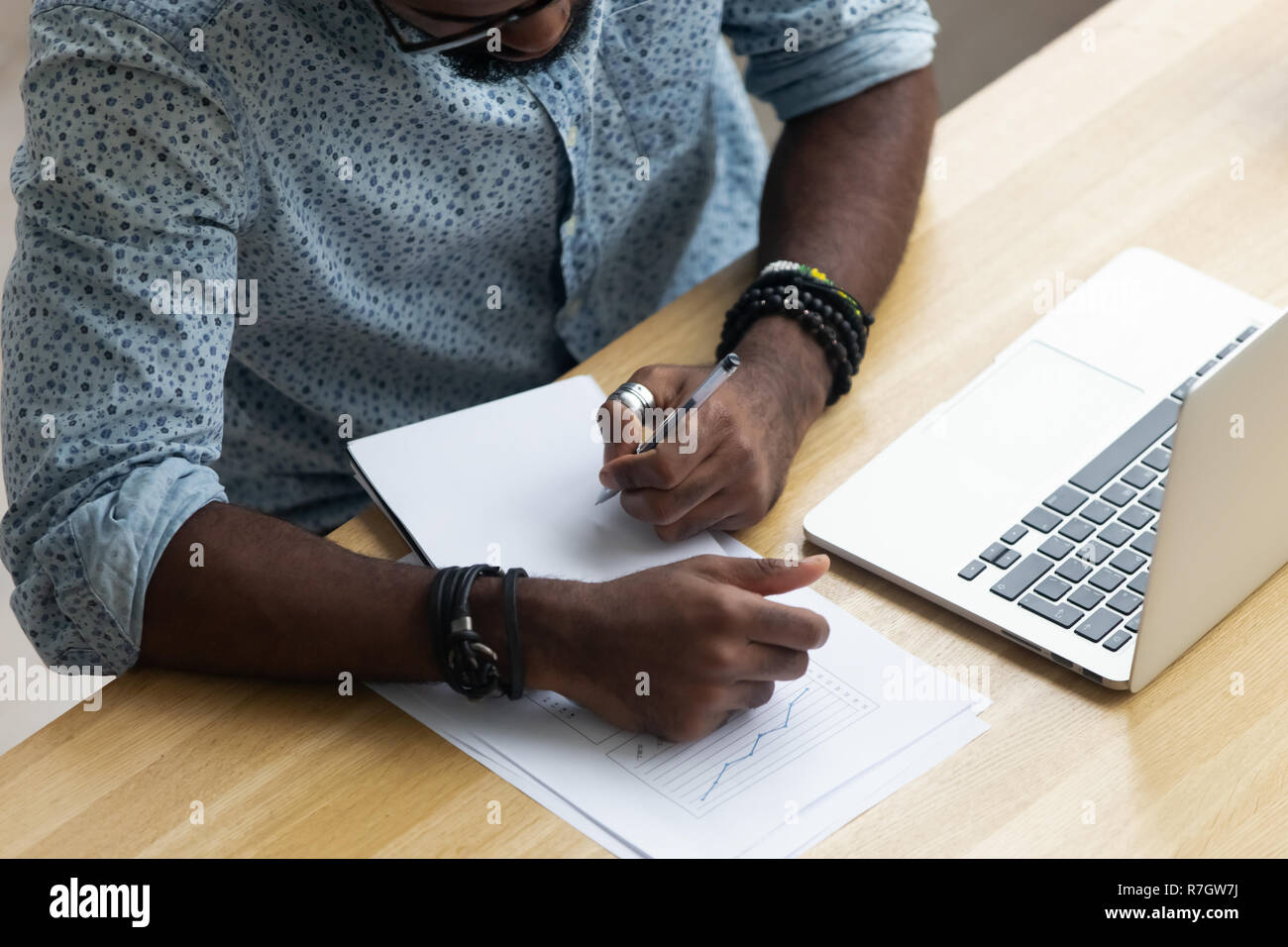 Top above view black manager working sitting at office desk Stock Photo ...