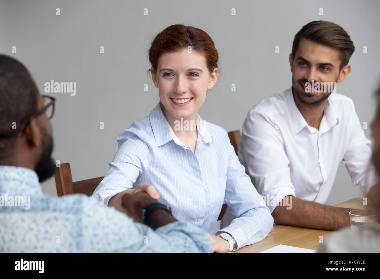 Partners greeting each other starting business meeting Stock Photo - Alamy