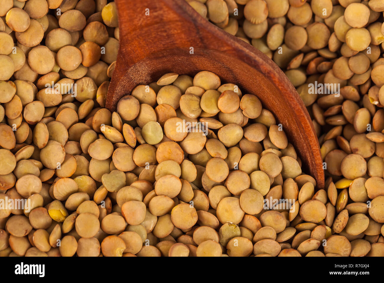 dry lentils on wooden spoon, healthy food Stock Photo - Alamy