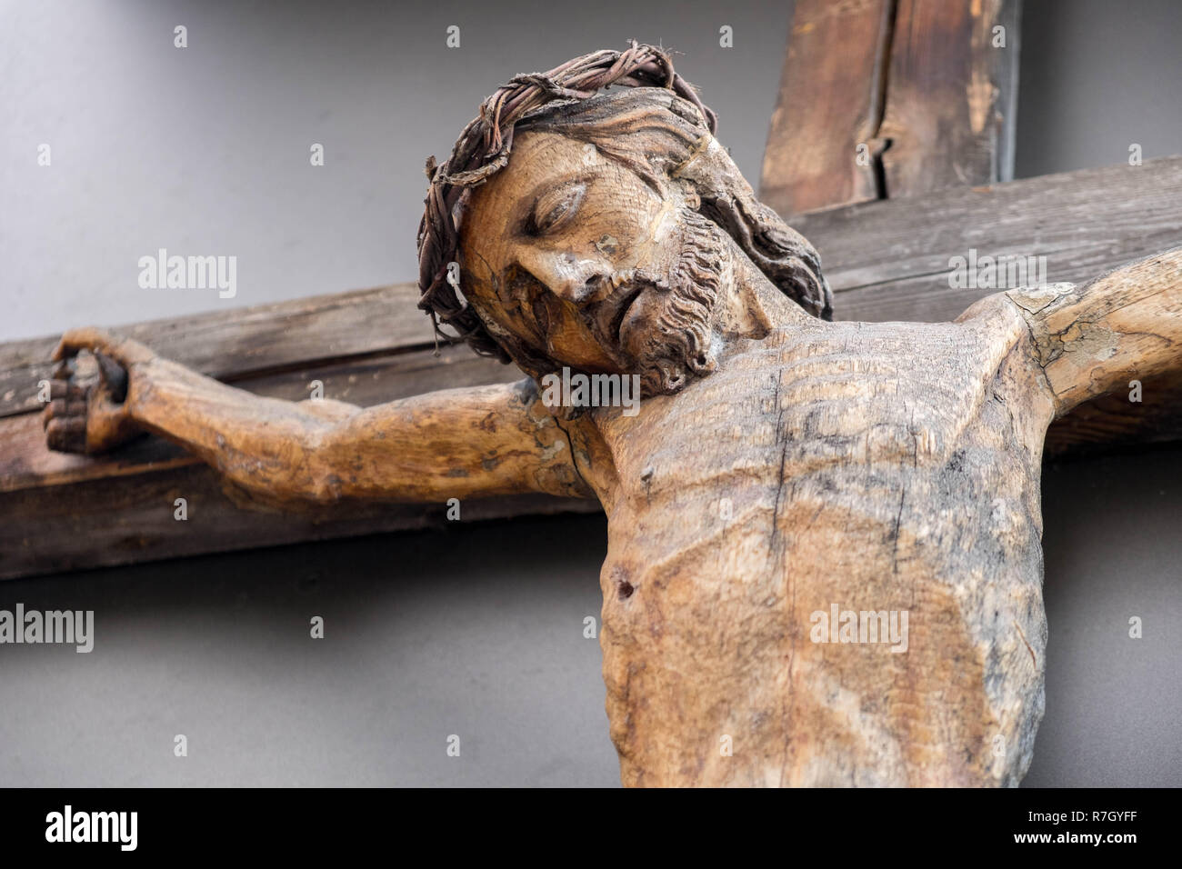 Holy Crucified Jesus Christ close-up. Ancient wooden sculpture. Bottom view. Sacred figure Stock ...