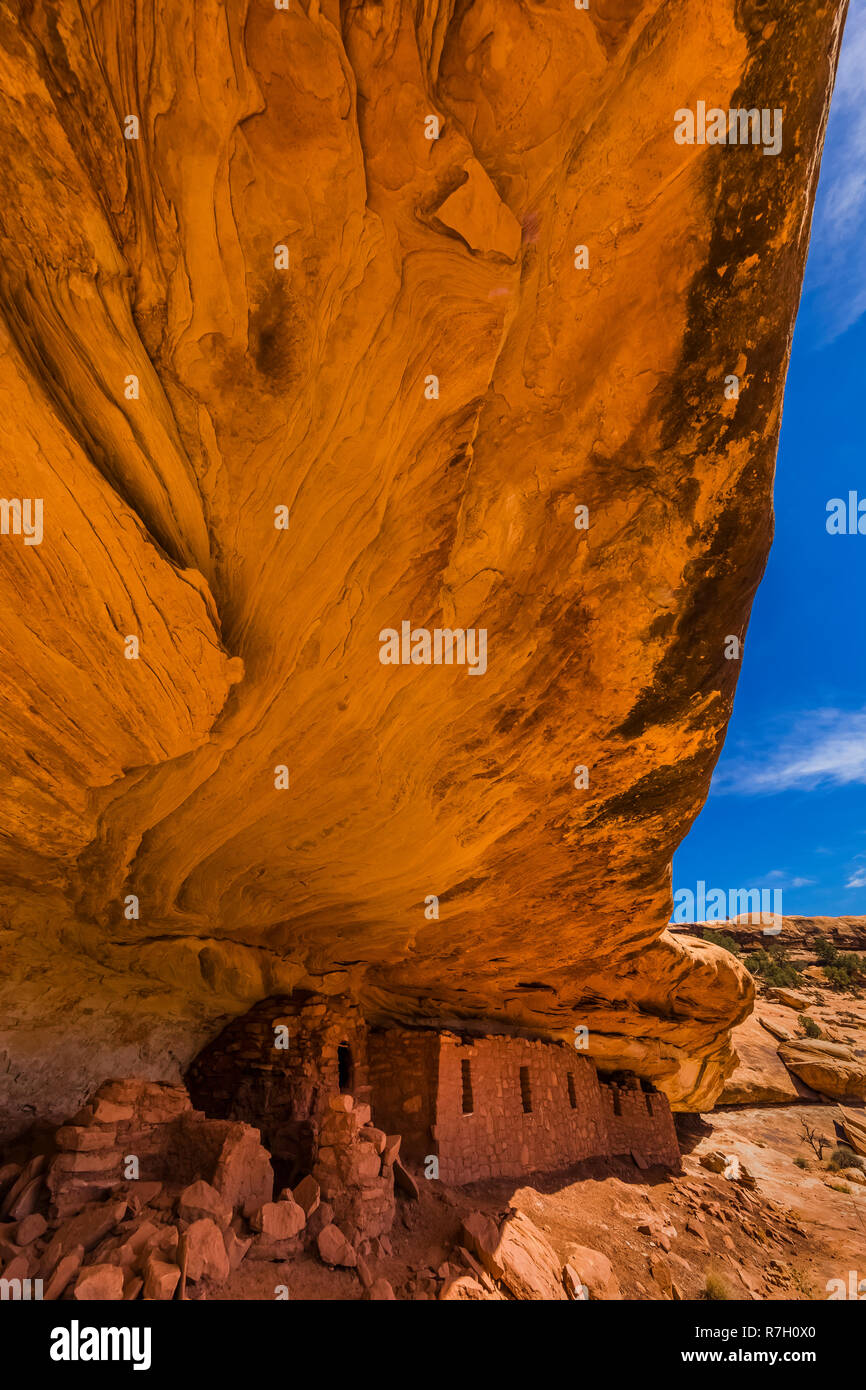 Structure tucked under a dramatic sandstone cliff at Moon House Ruin on ...