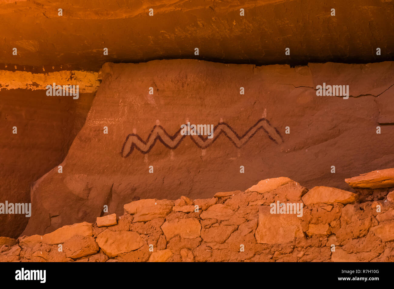A dramatic snake petroglyph painted on wall of Moon House Ruin on Cedar ...