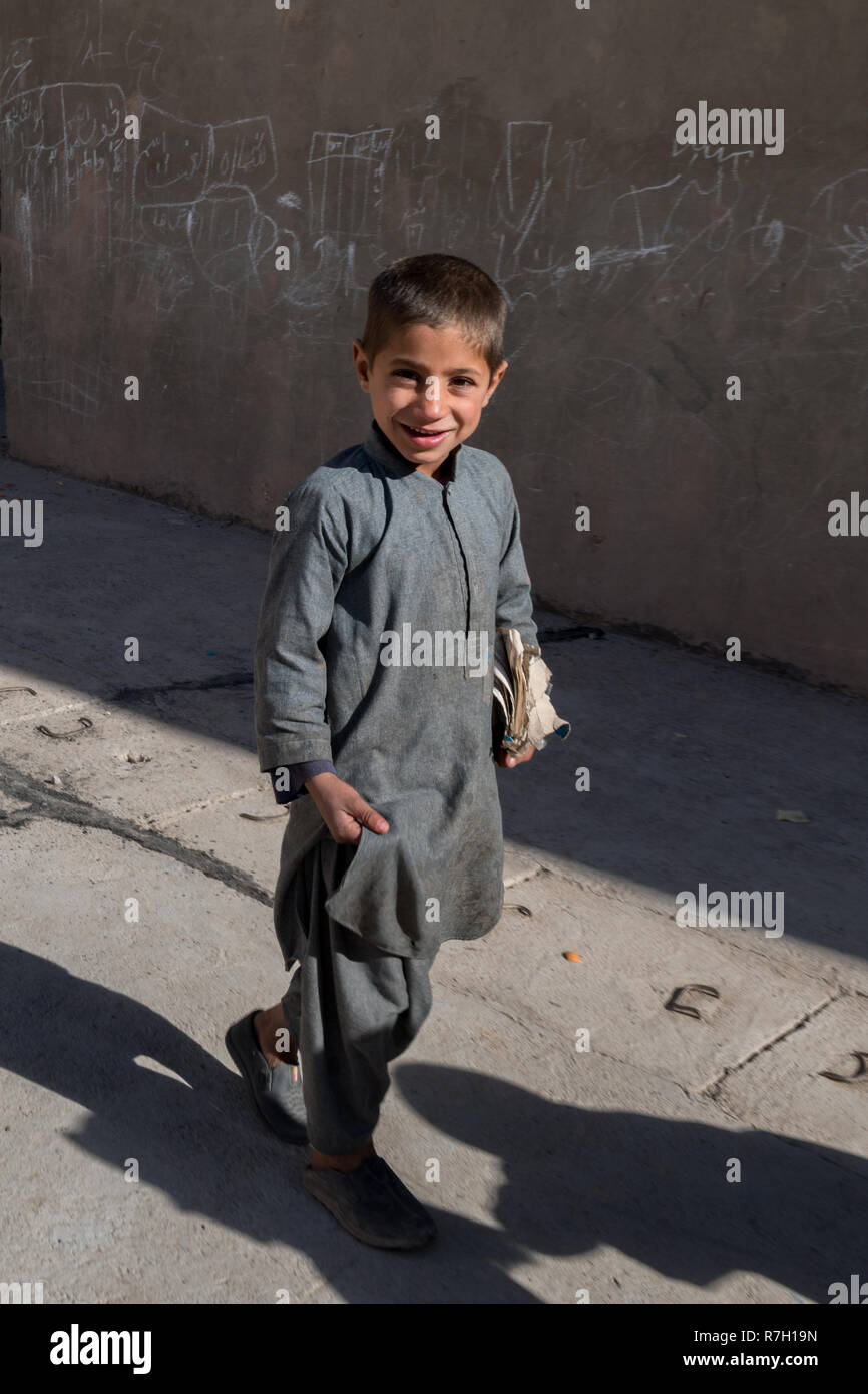 Boy Coming Out Of School in Old City Street, Herat, Herat Province ...