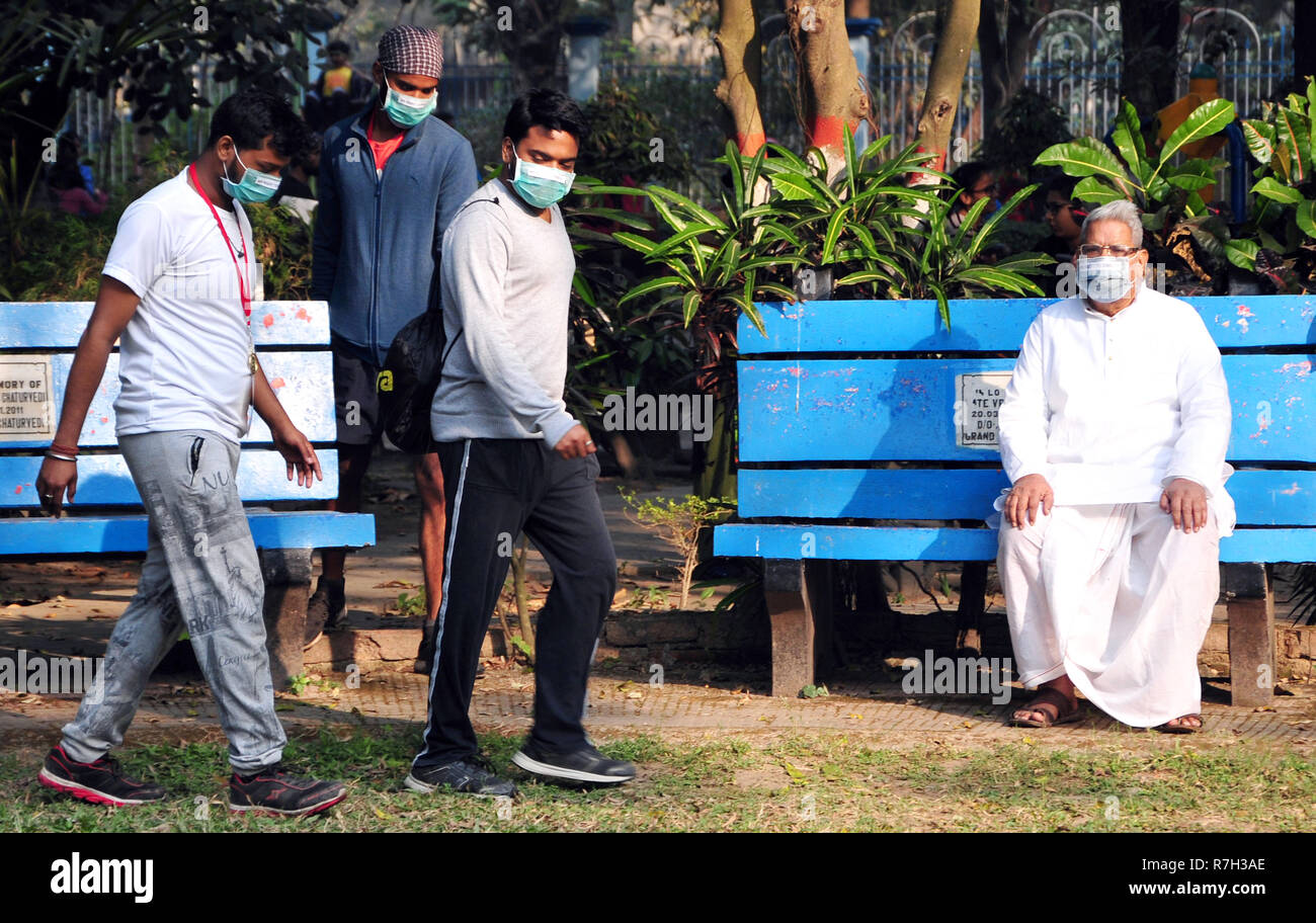 Kolkata, India. 09th Dec, 2018. People wear pollution mask during an ...