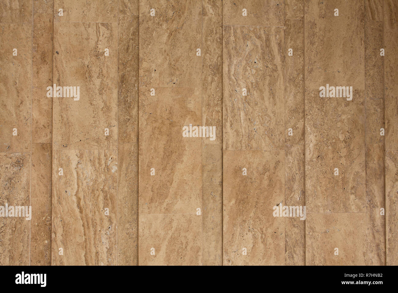 Beige wall vertical tiles texture inside a building Stock Photo - Alamy