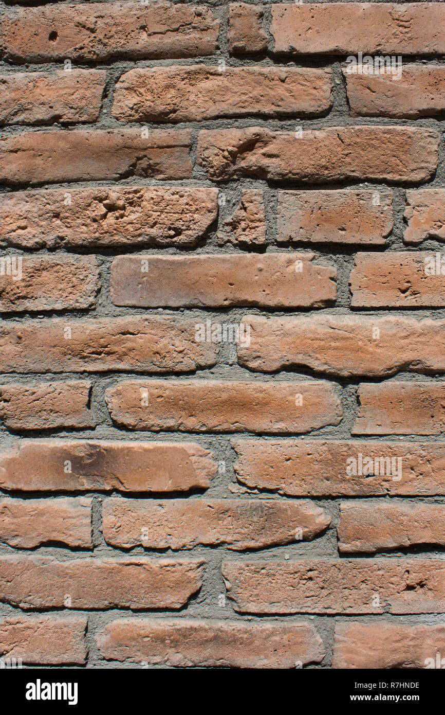 Wall reddish bricks plates grunge vertical texture Stock Photo - Alamy