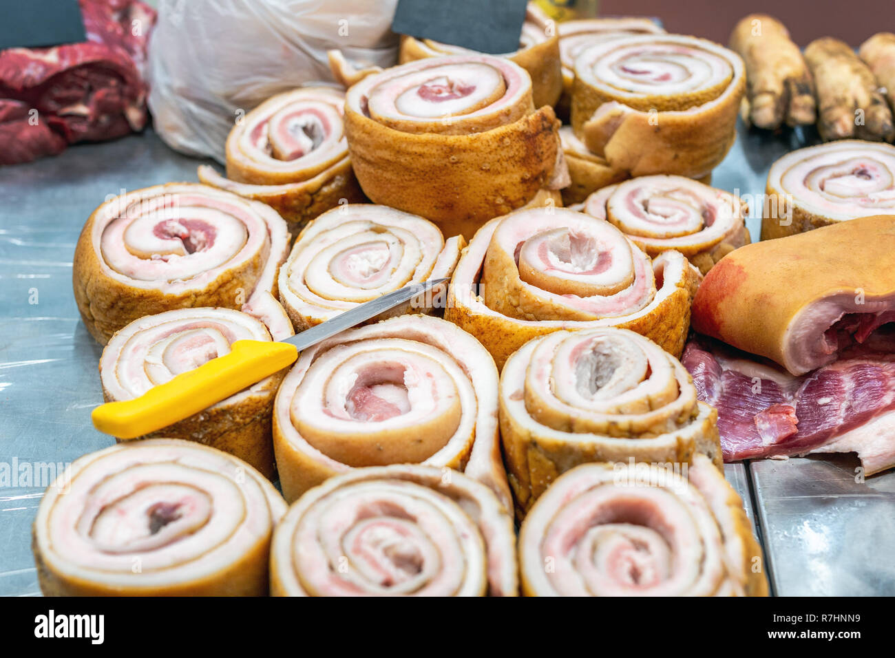 Raw pork fat rolls at market counter. Fresh lard at local farmer market ...