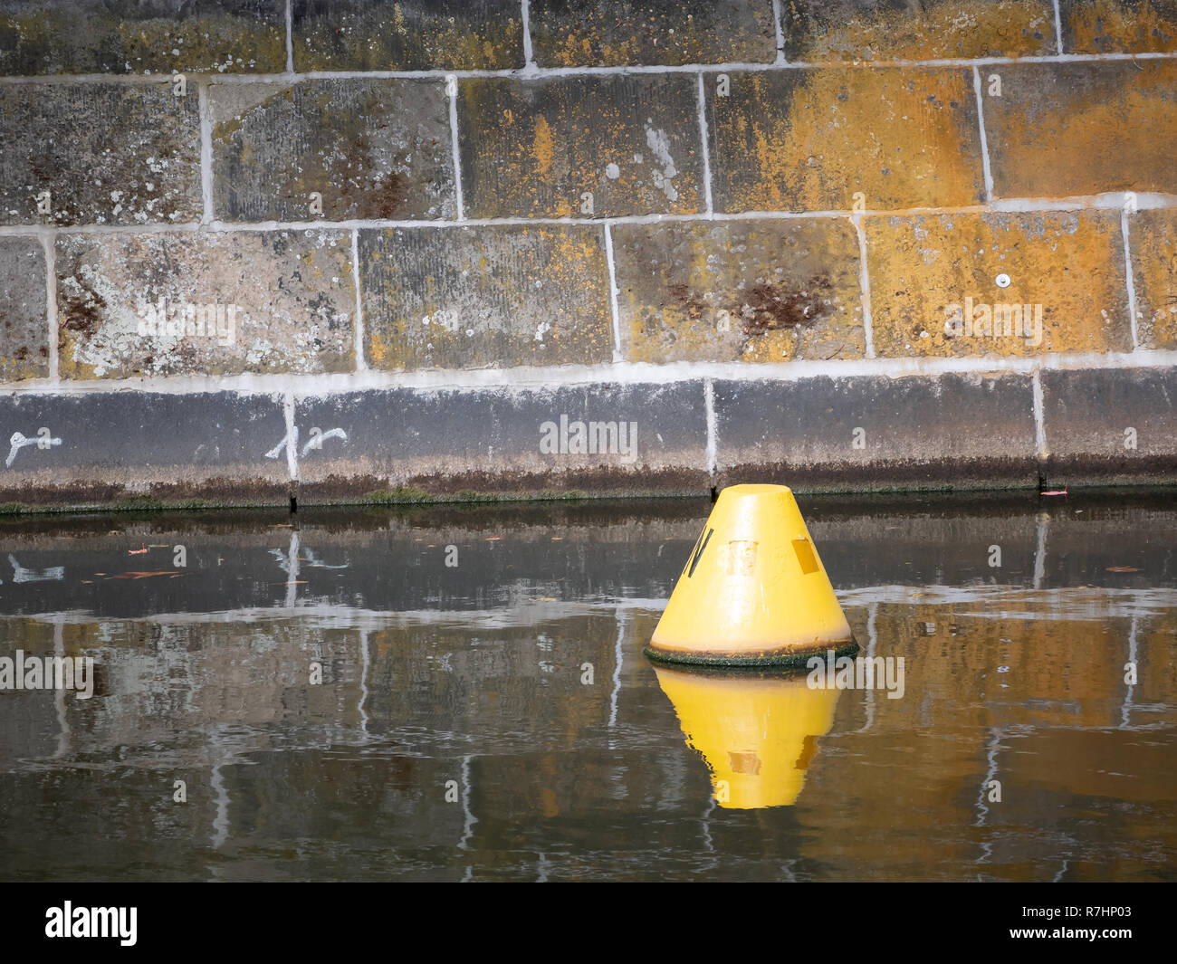 Yellow Buoy Floating In A Canal In Berlin, Germany Stock Photo - Alamy