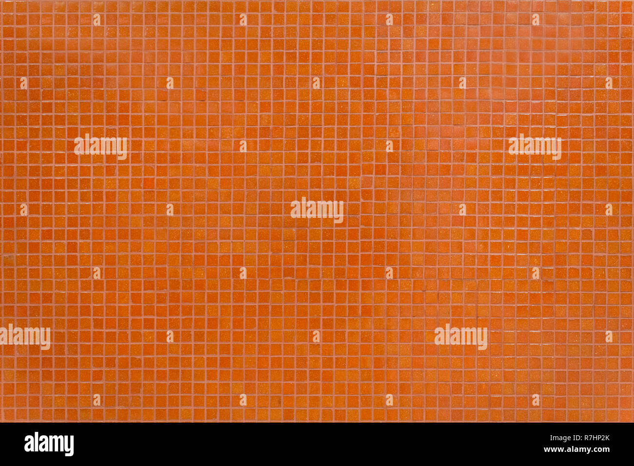 Wall orange tiles with little mosaic squares Stock Photo - Alamy