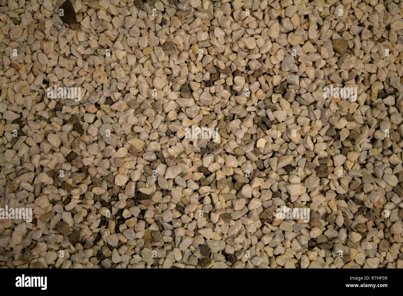 Sand texture with pebbles Stock Photo - Alamy