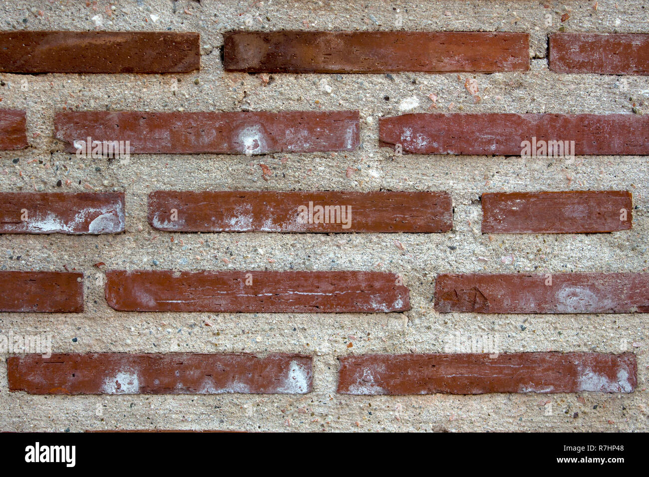 Wall reddish bricks and concrete Stock Photo - Alamy