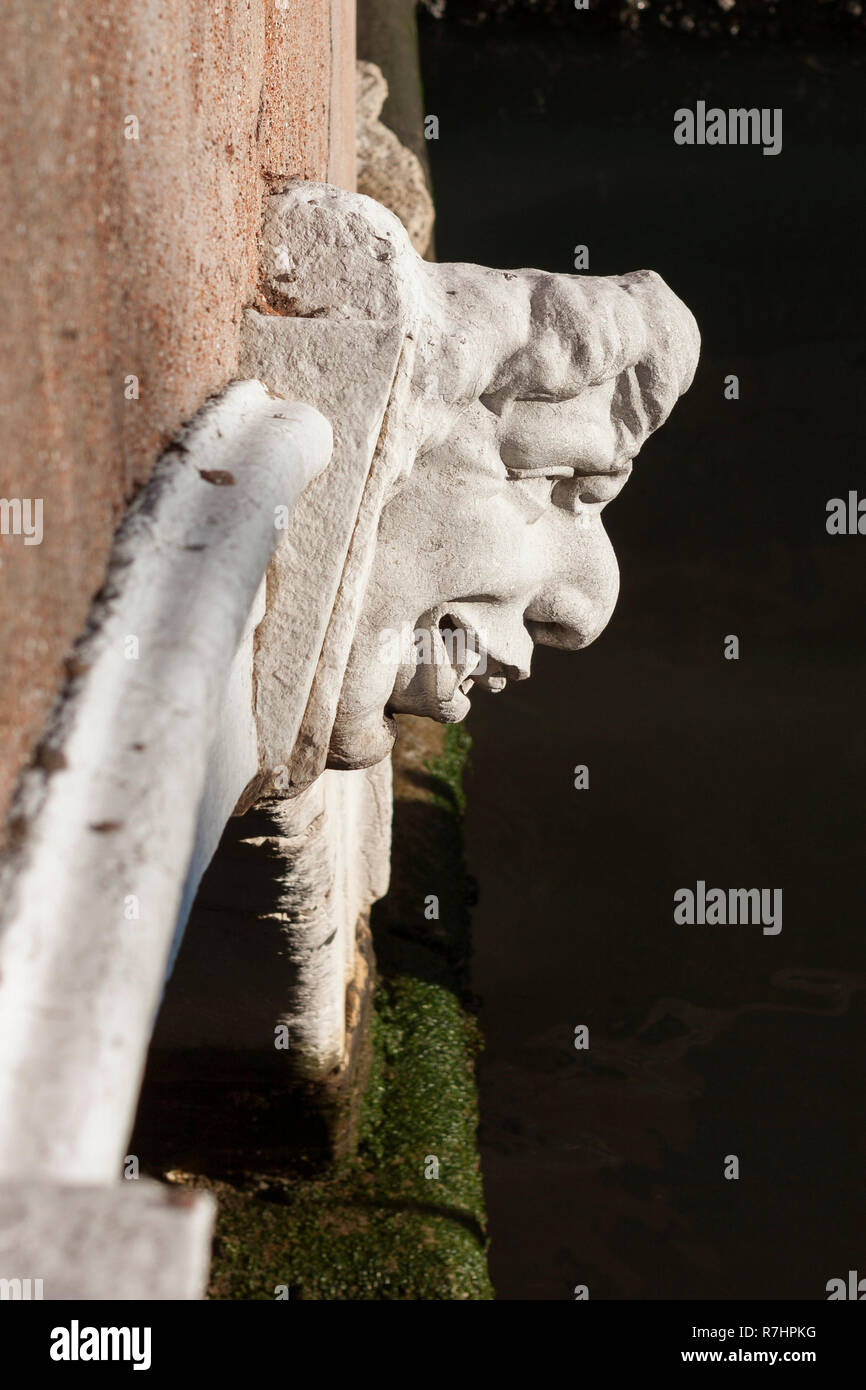 Human head sculpture on a bridge in Venezia, Italy Stock Photo - Alamy