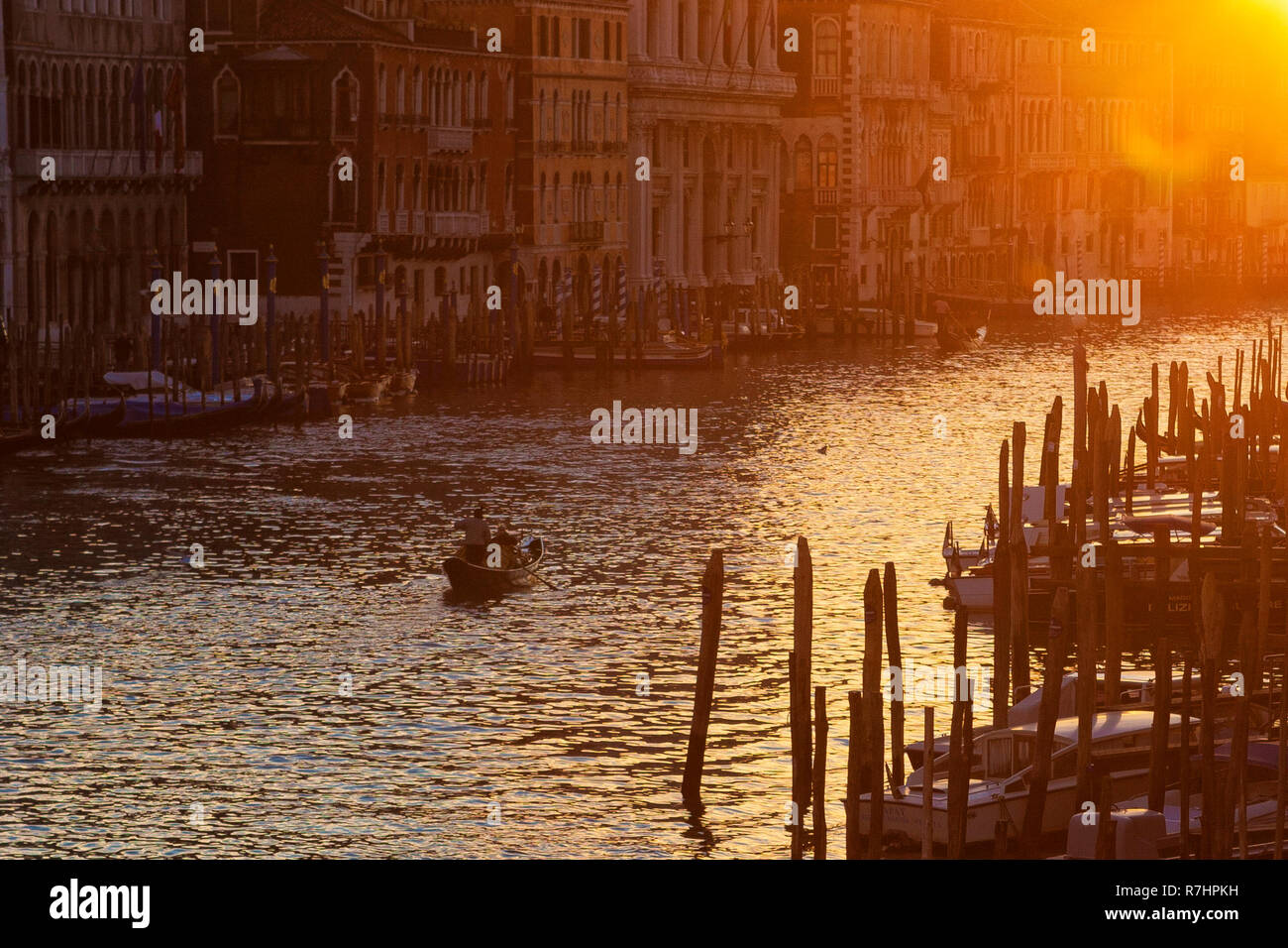 A Gondola rowing on Grand Canal ( it. "Canal Grande) at sunset in ...