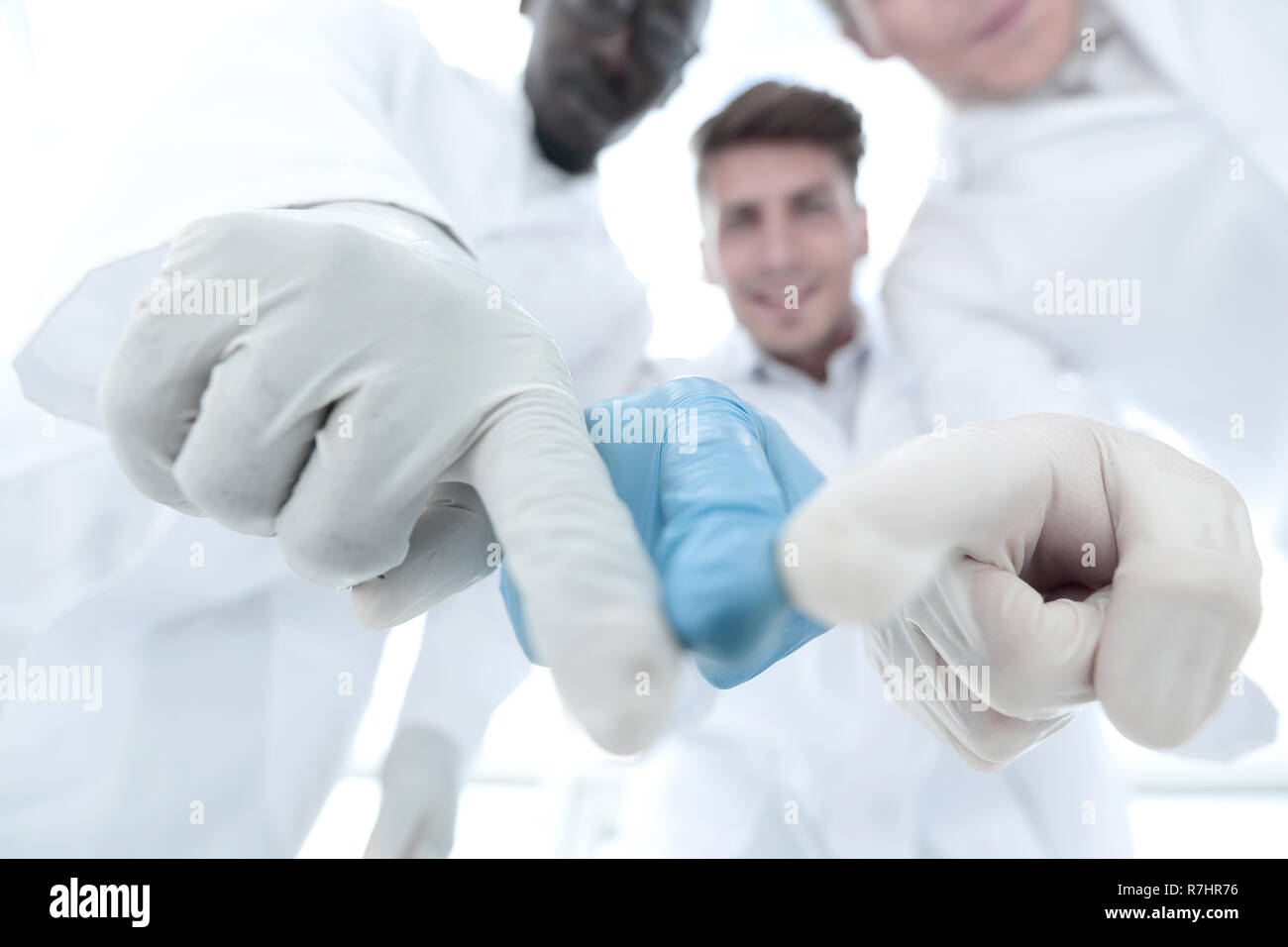 group of scientists pointing to the laboratory table Stock Photo - Alamy