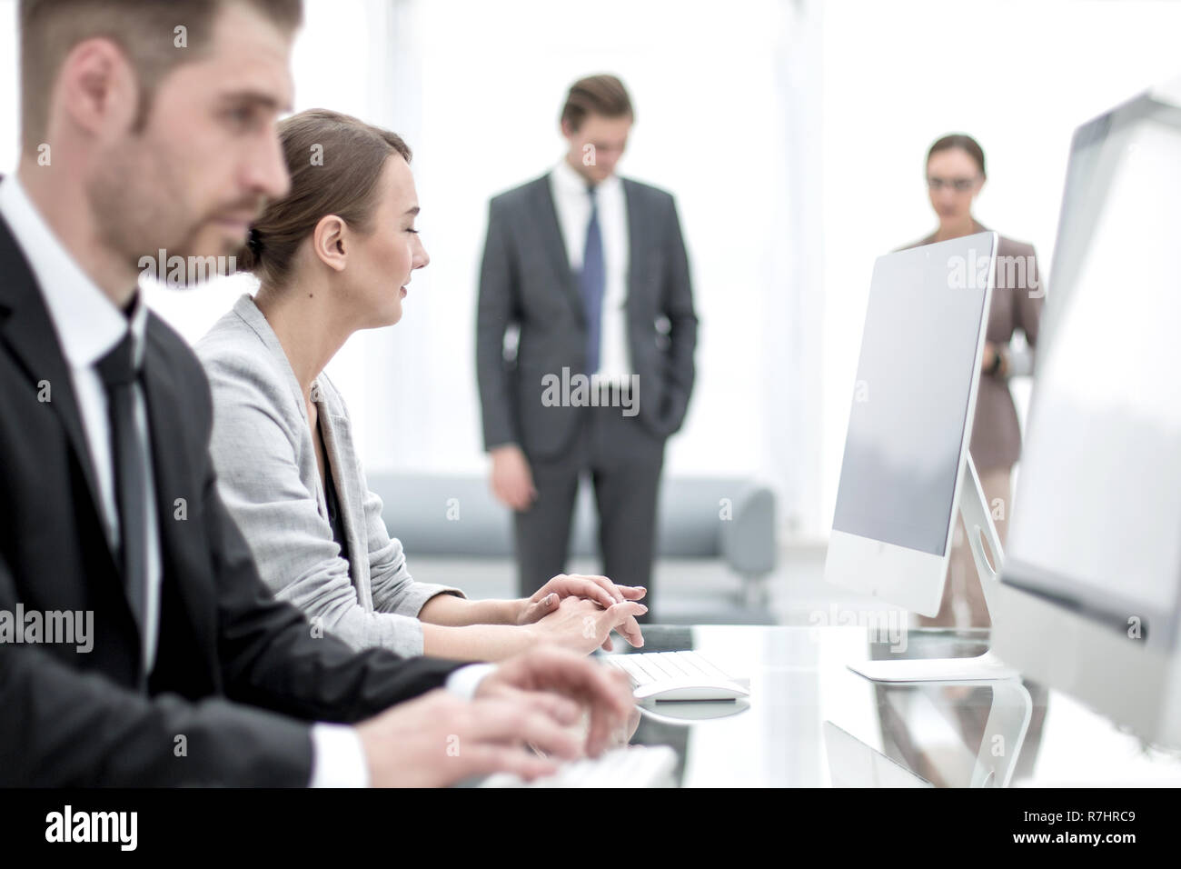 employees work on computers in the Bank lobby Stock Photo - Alamy