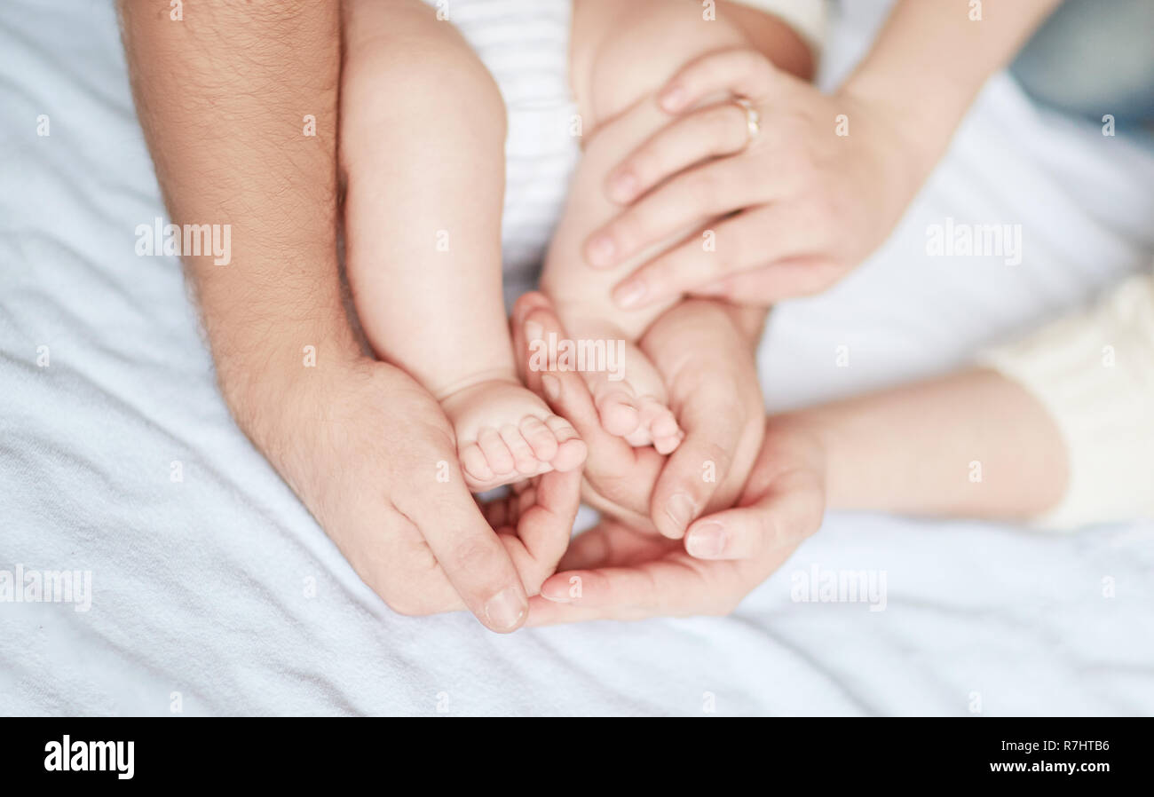 Child hugging parent leg hi-res stock photography and images - Alamy