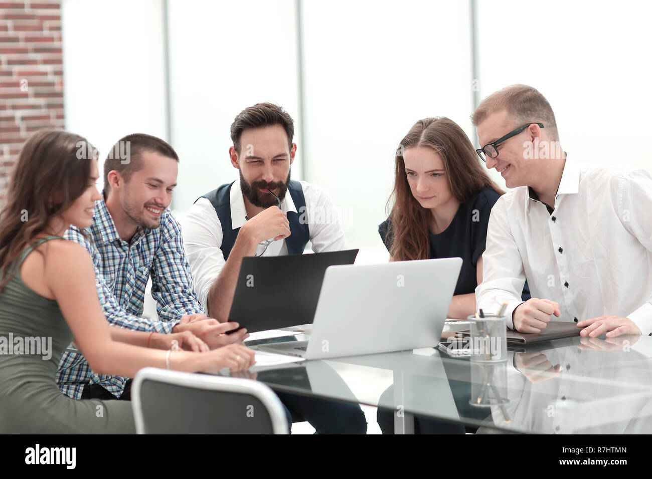 business team discusses new ideas sitting at the office Desk Stock ...