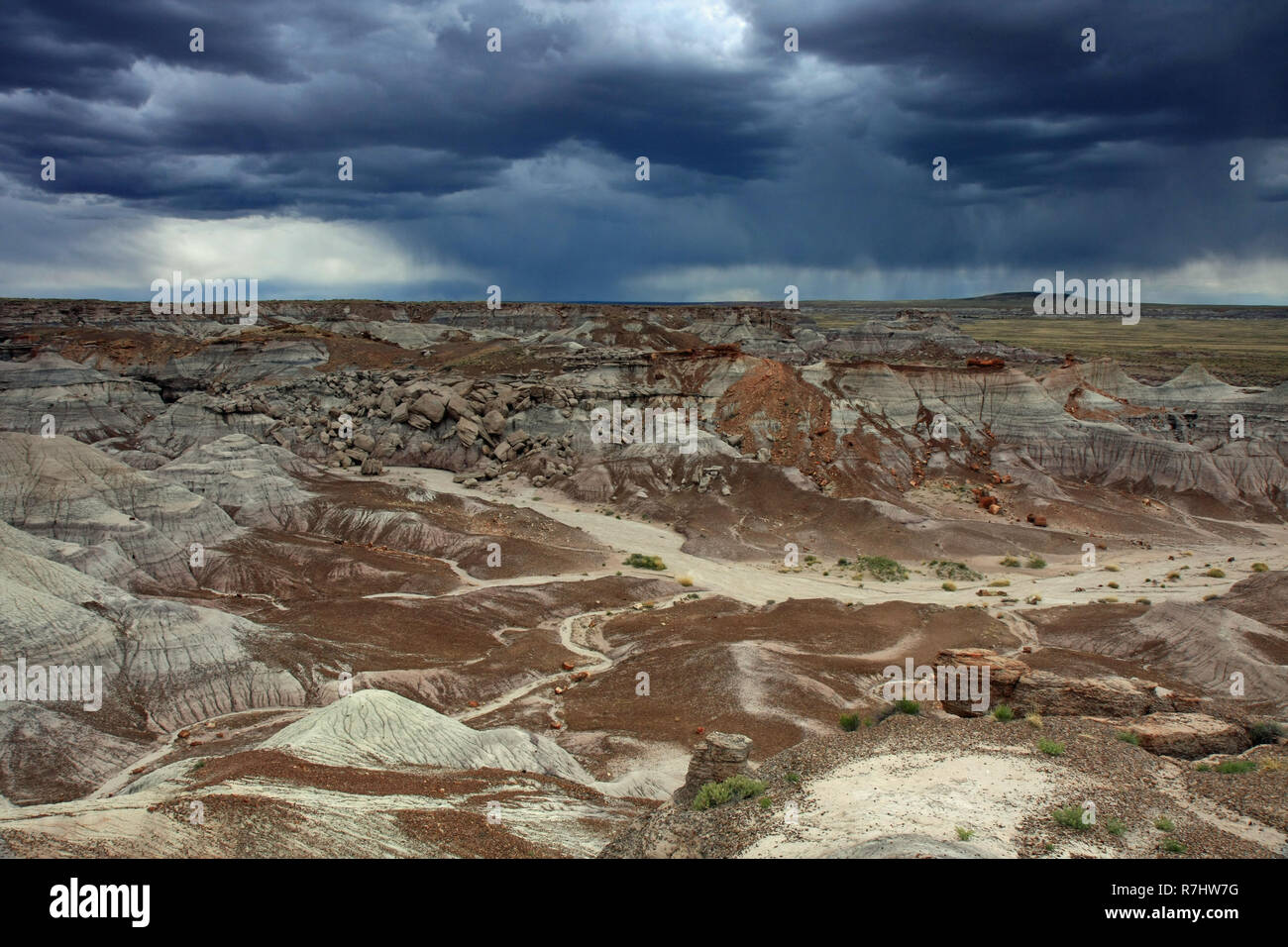 Badlands of the Painted Desert under a gathering rain storm in ...